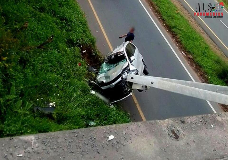 Driver miraculously escapes serious injury as car veers off bridge and ...